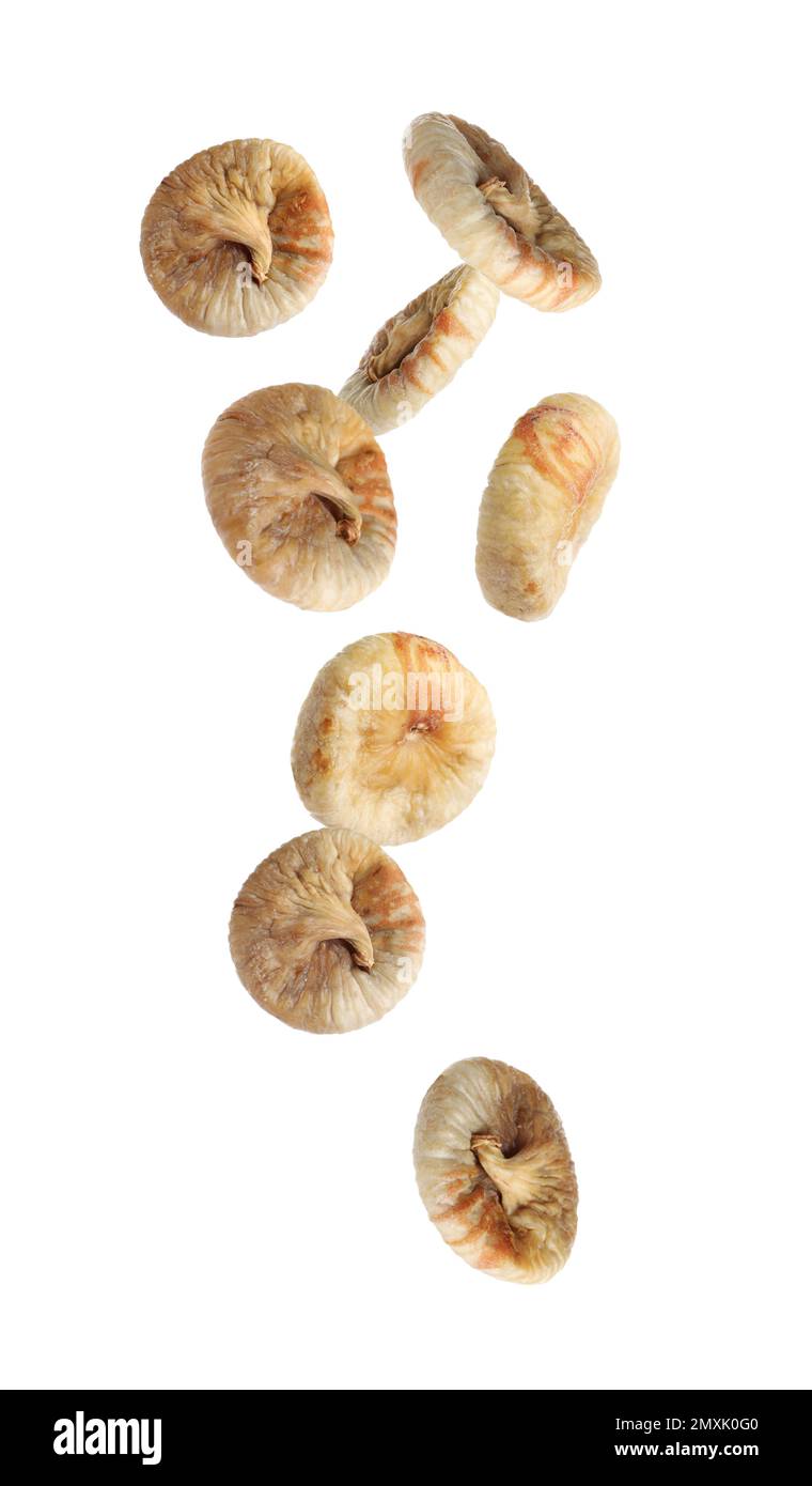 Dried fig fruits falling on white background Stock Photo - Alamy