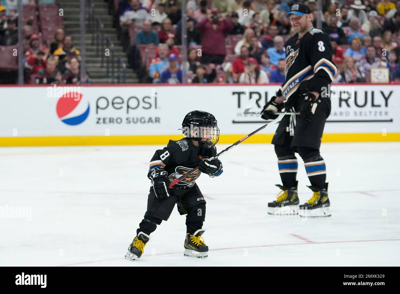 Washington Capitals' Alex Ovechkin (8) smiles at his son Sergei, 4 ...