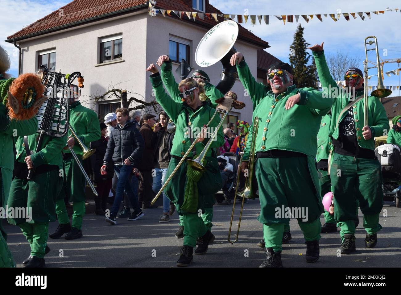 A Group of people dressed in festive costumes celebrating the Fasching ...