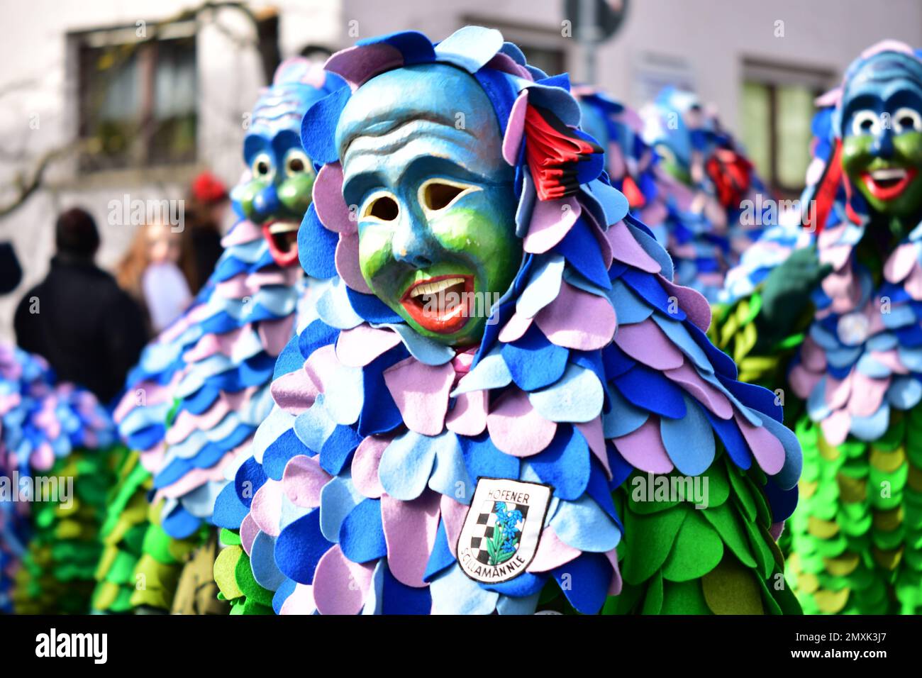 A Group of people dressed in festive costumes celebrating the Fasching ...