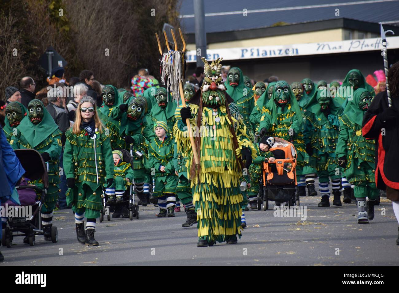 A Group of people dressed in festive costumes celebrating the Fasching ...