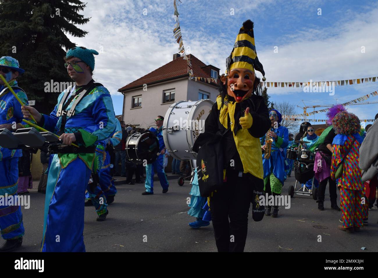 A Group of people dressed in festive costumes celebrating the Fasching ...