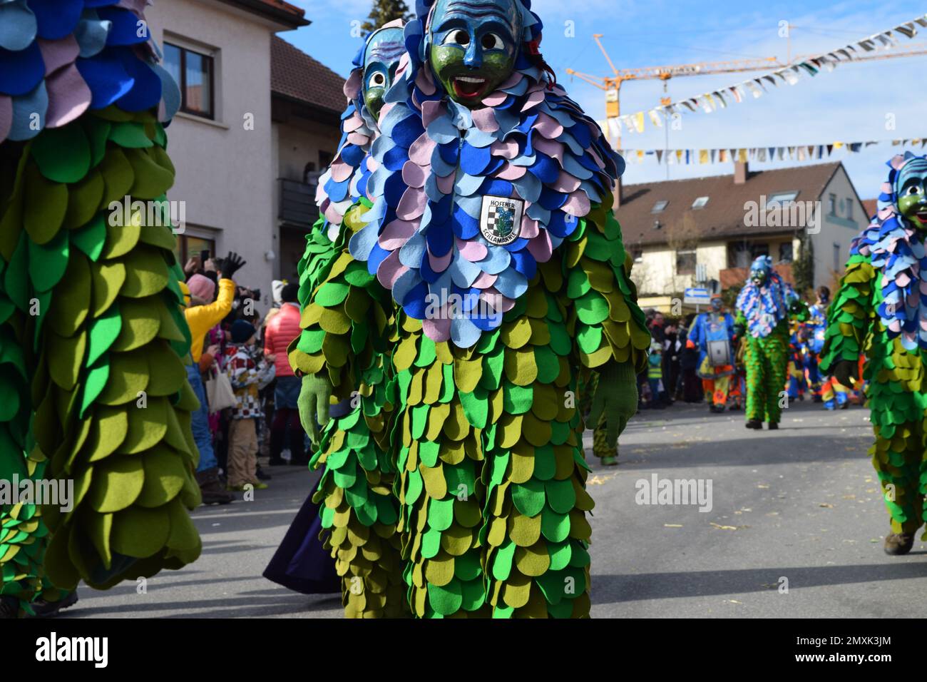 A Group of people dressed in festive costumes celebrating the Fasching ...