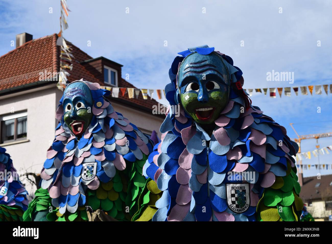 A Group of people dressed in festive costumes celebrating the Fasching ...