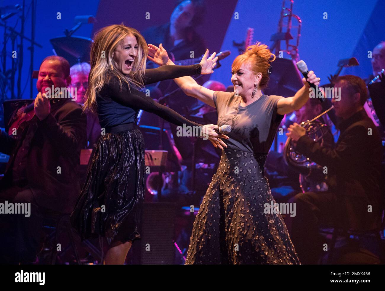 Actress Sarah Jessica Parker, left, embraces singer and actress Andrea ...