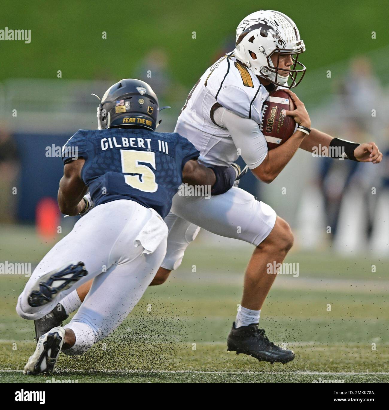 Western Michigan quarterback Zach Terrell, right, is tackled by Akron ...