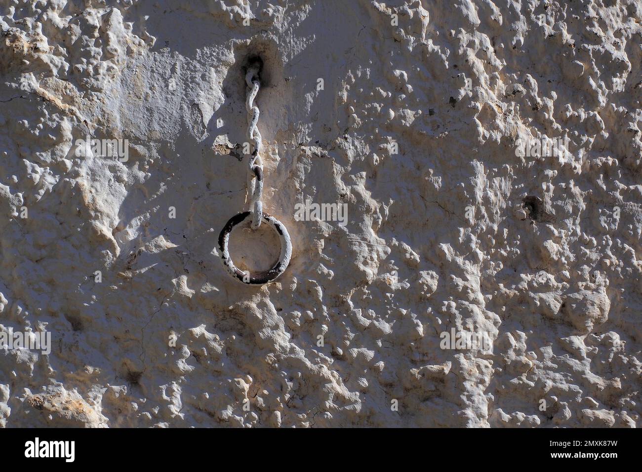 White wall with metal ring on chain, Spain, Europe Stock Photo - Alamy