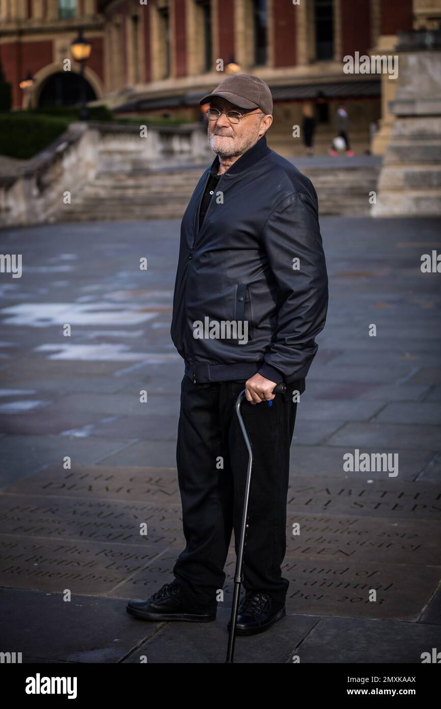 Singer Phil Collins poses for photographers during a photo call to ...