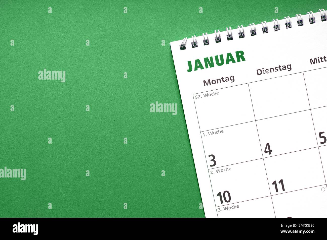 german calendar for the month january on green paper background with ...
