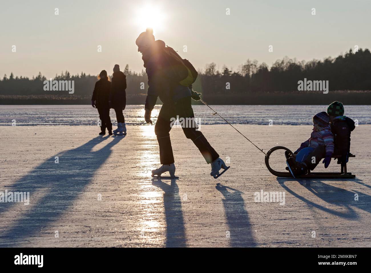 People skating frozen lake hi-res stock photography and images - Alamy