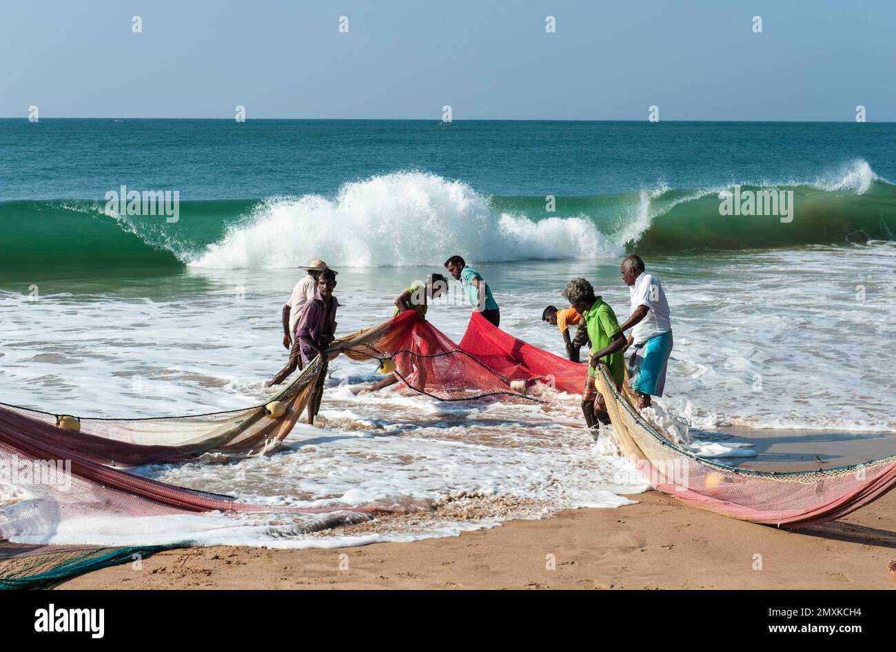 High wave, fishermen at work, fishermen hauling in nets from the sea ...