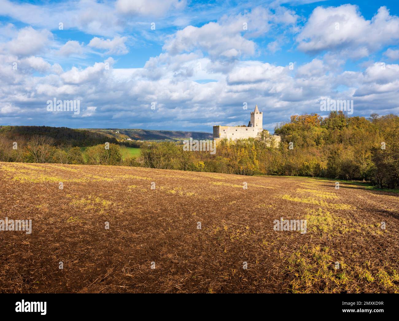 Autumn landscape with Rudelsburg castle ruins, harvested field, stormy ...