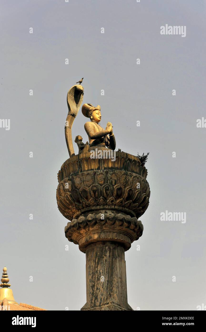 Statue of King Yoganarendra Malla with snake and bird, Patan Kathmandu ...