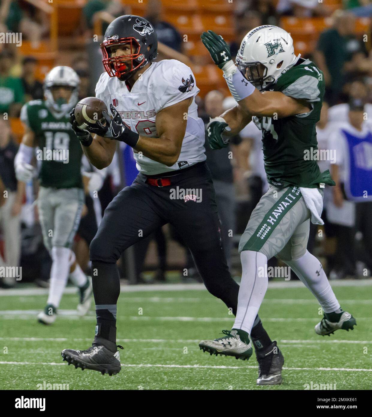 UNLV tight end Andrew Price (88) catches a pass while being defended by ...
