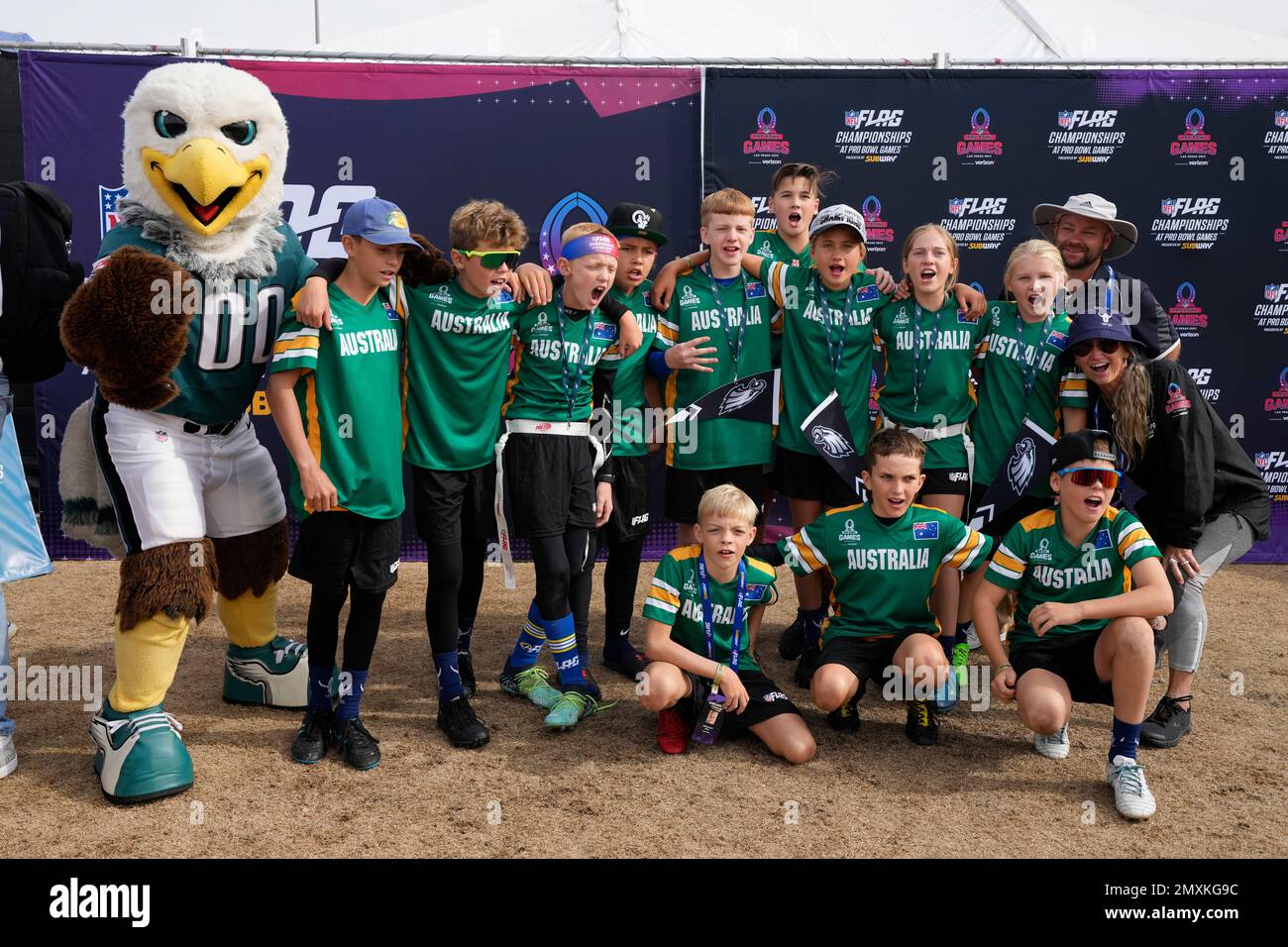 Philadelphia Eagles mascot Swoop poses with the Australia flag team during the NFL Flag ...