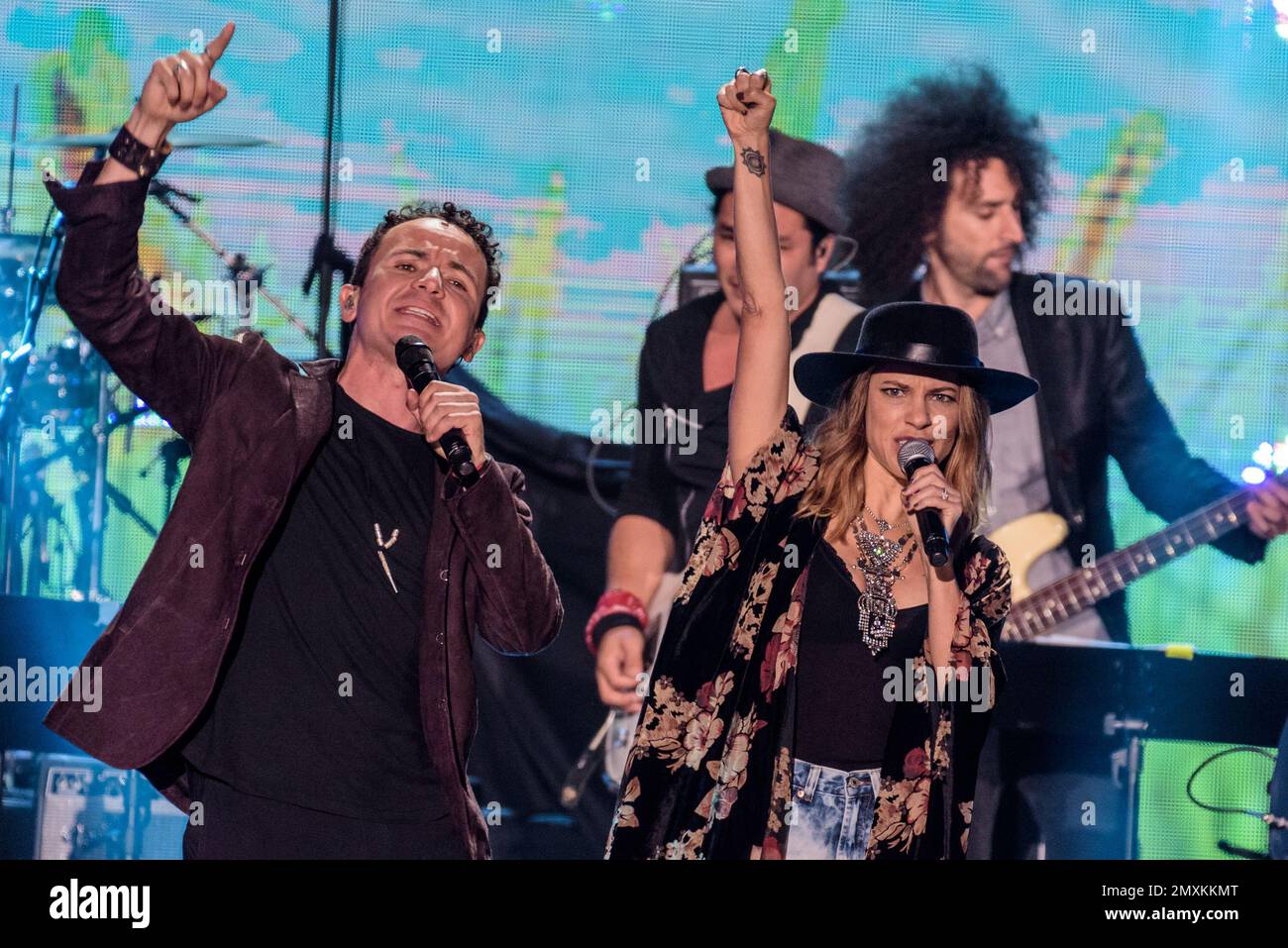 Juan Fernando Fonseca, left, and Debi Nova perform at RiseUp As One at ...