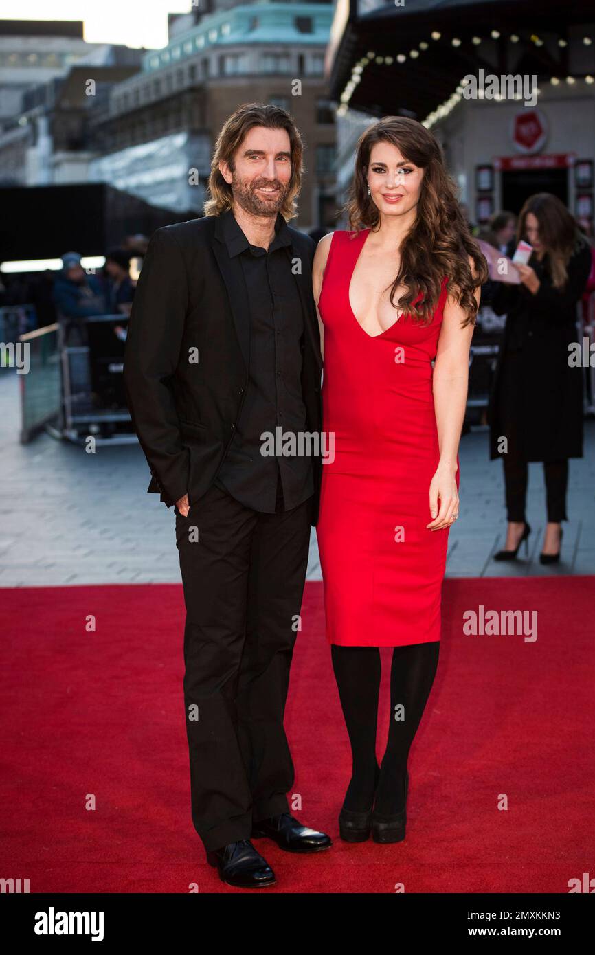 Actor Sharlto Copley and model Tanit Phoenix pose for photographers ...