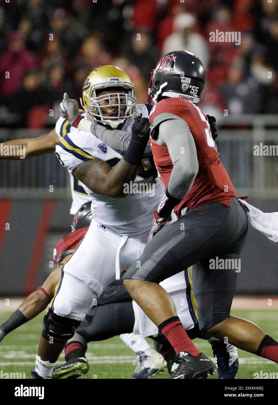 UCLA offensive lineman Najee Toran, left, blocks Washington State ...