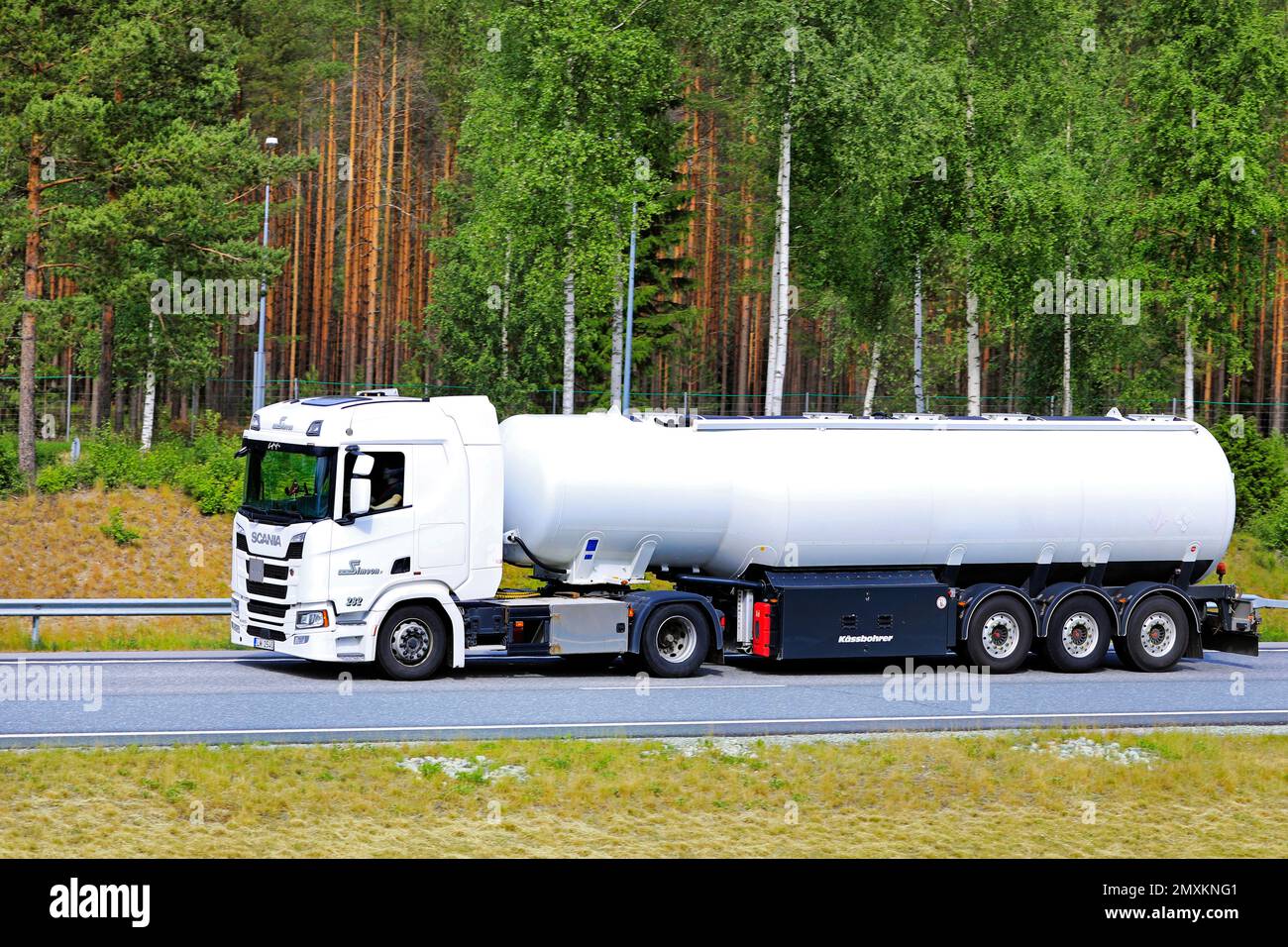 White Scania truck Simeon pulls Kaessbohrer semi tank trailer on ...