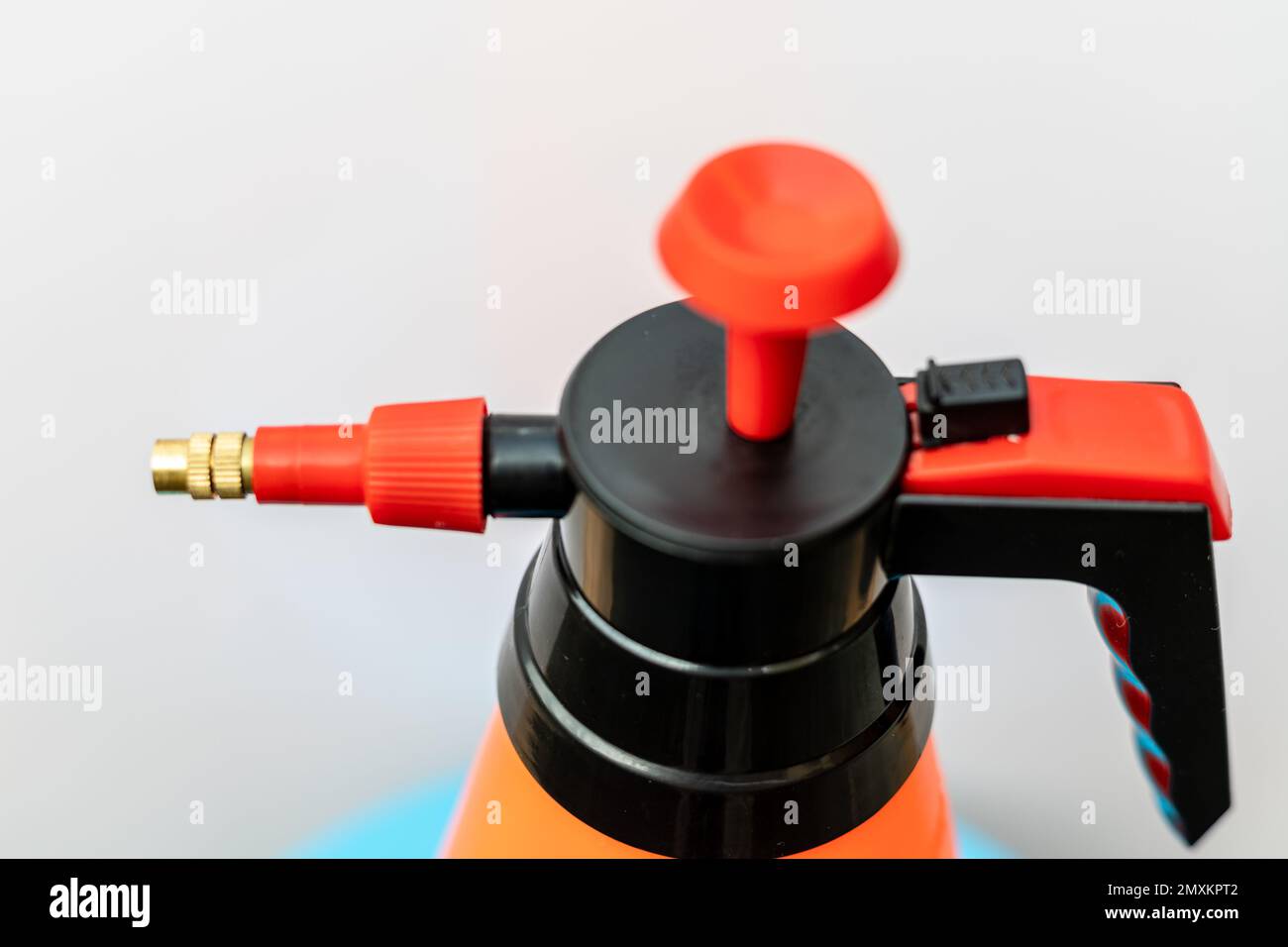 Closeup of a small sprayer on white isolated background Stock Photo - Alamy