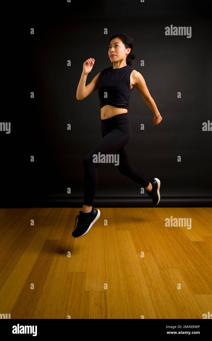 Beautiful Young Asian Woman Running | Studio Set | Black Backdrop ...