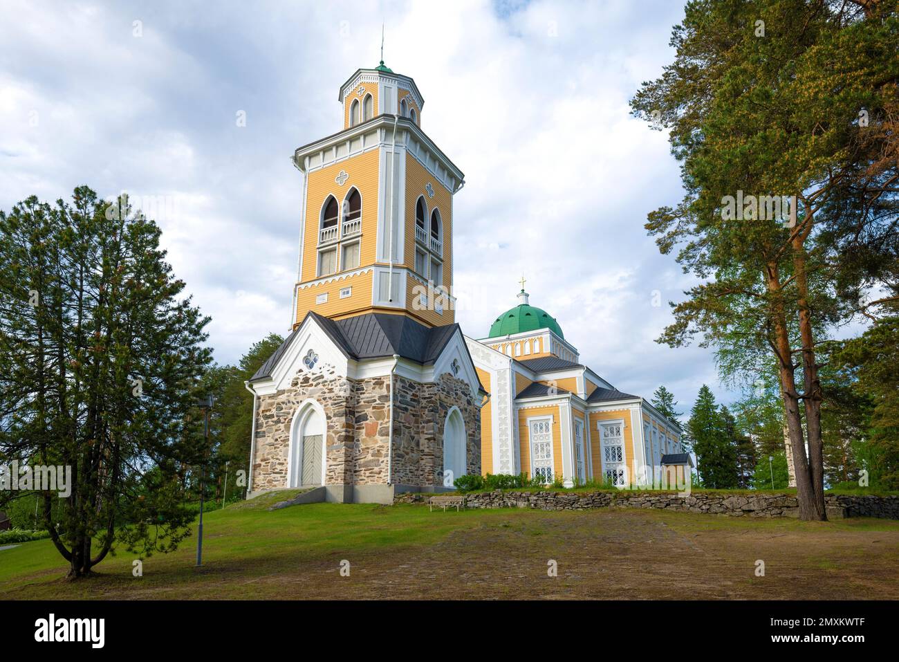 View of Finland's largest wooden church on a June cloudy morning ...