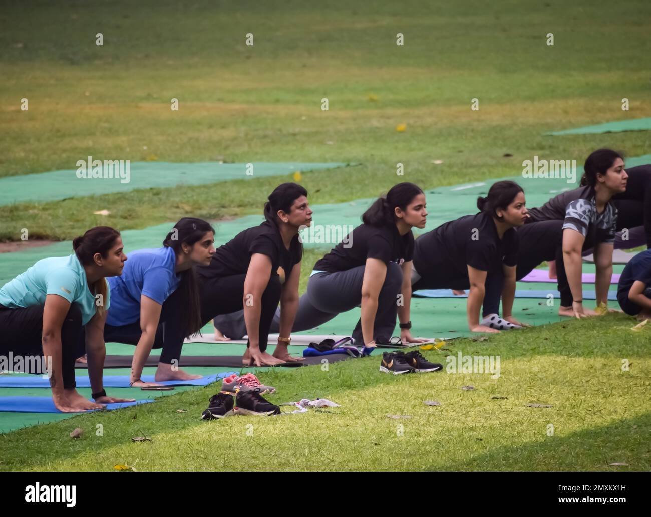 New Delhi, India, June 18 2022 - Group Yoga exercise class Surya ...
