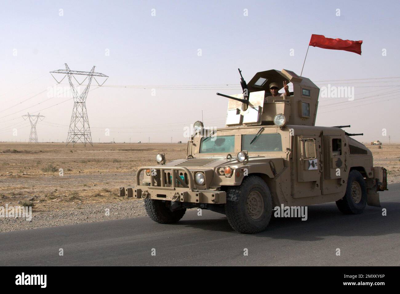 An Iraqi soldier in a military convoy heading toward Qayara base in ...