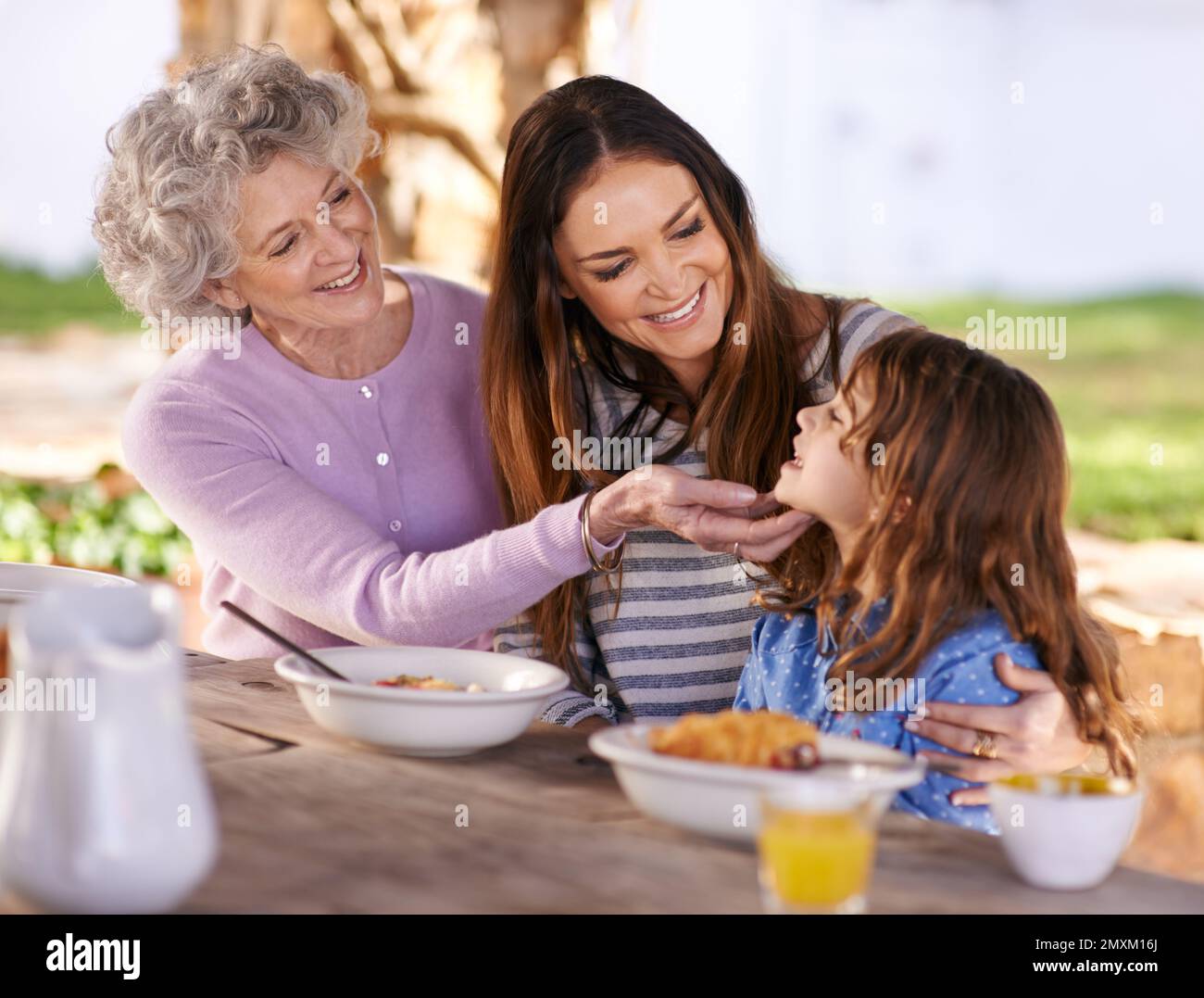 Bonding over breakfast. a happy multi-generational family having ...