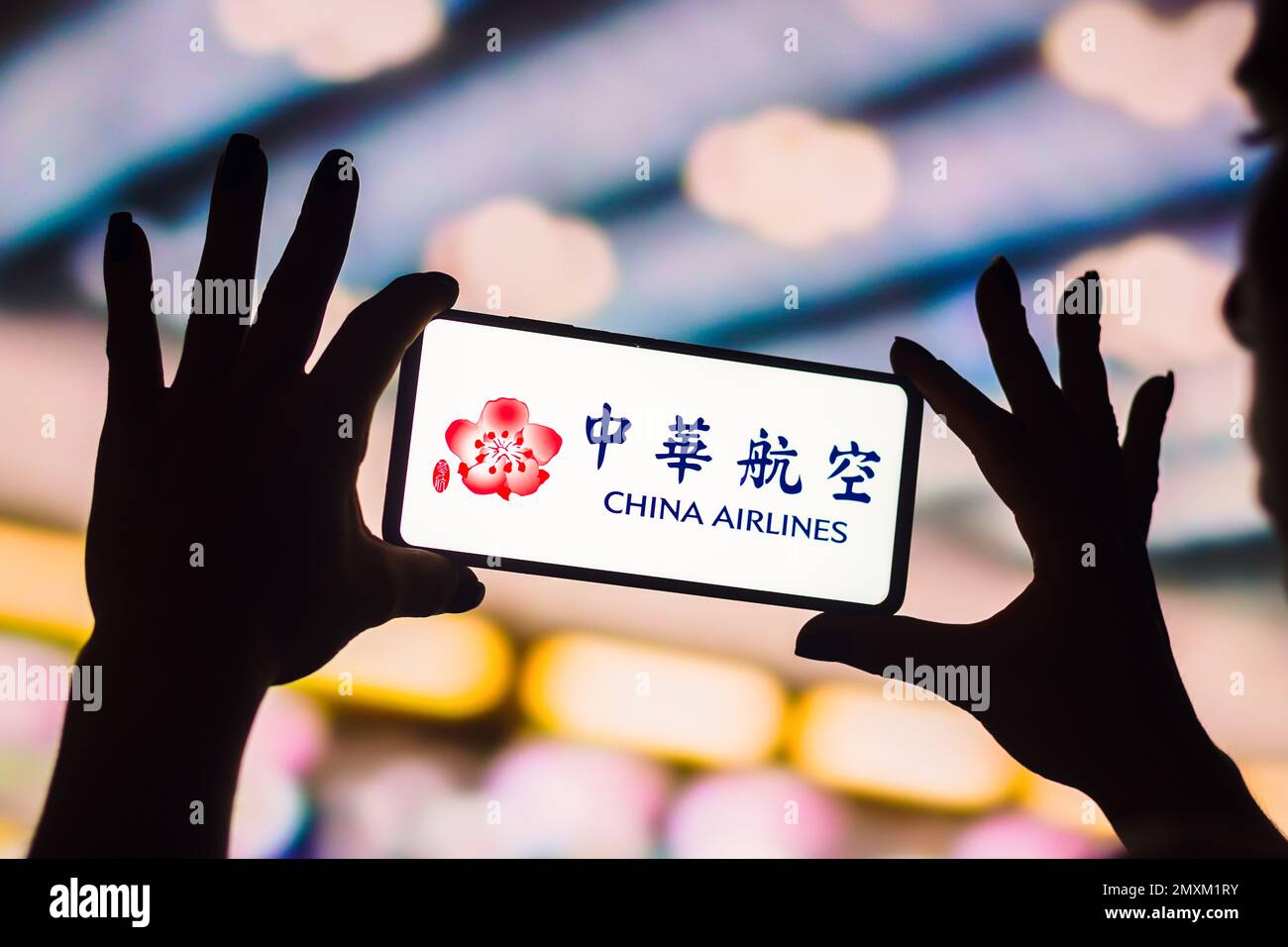 In this photo illustration, the China Airlines logo is displayed on a ...