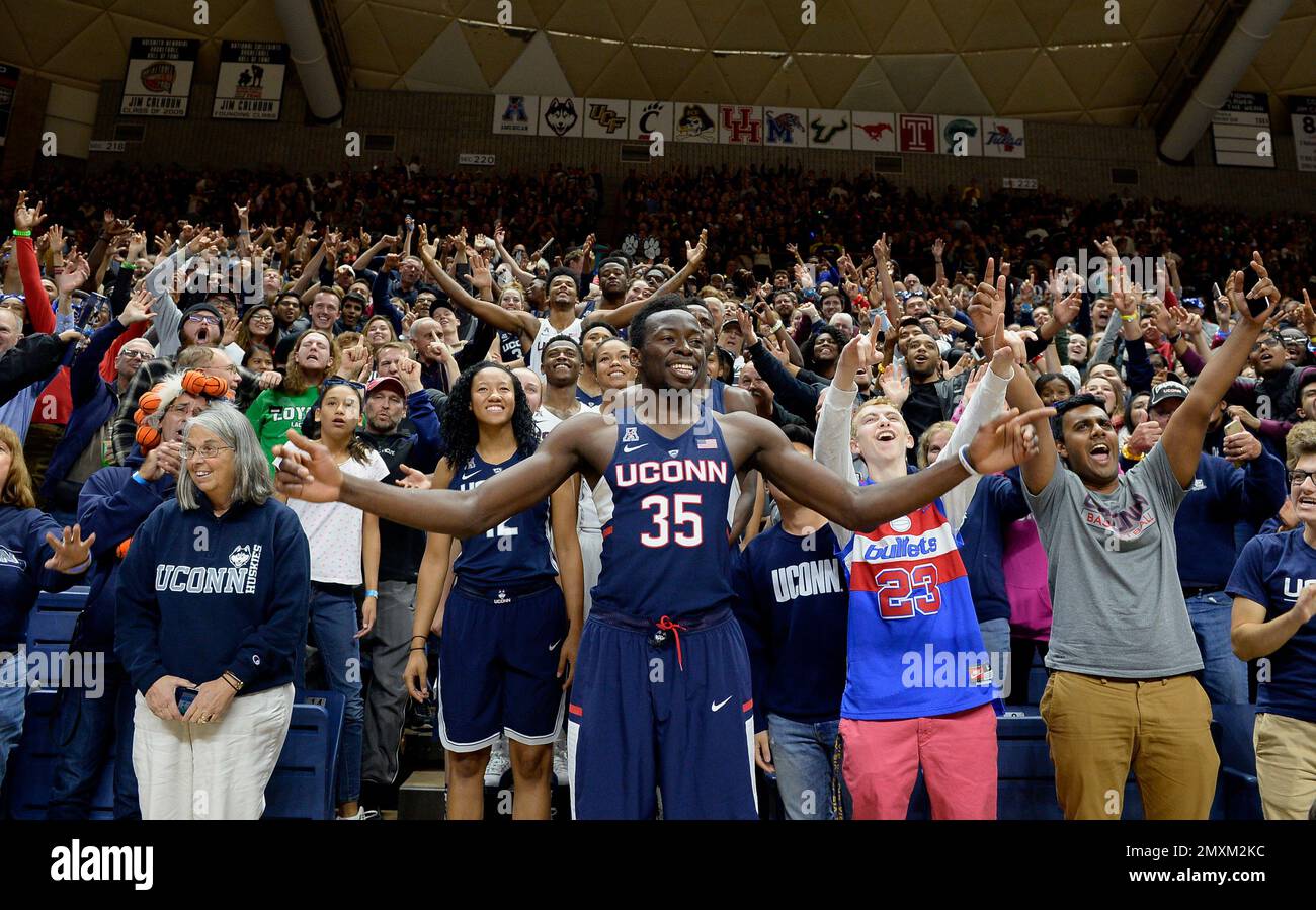 Connecticut's Amida Brimah (35) stands with fans and the UConn men's ...