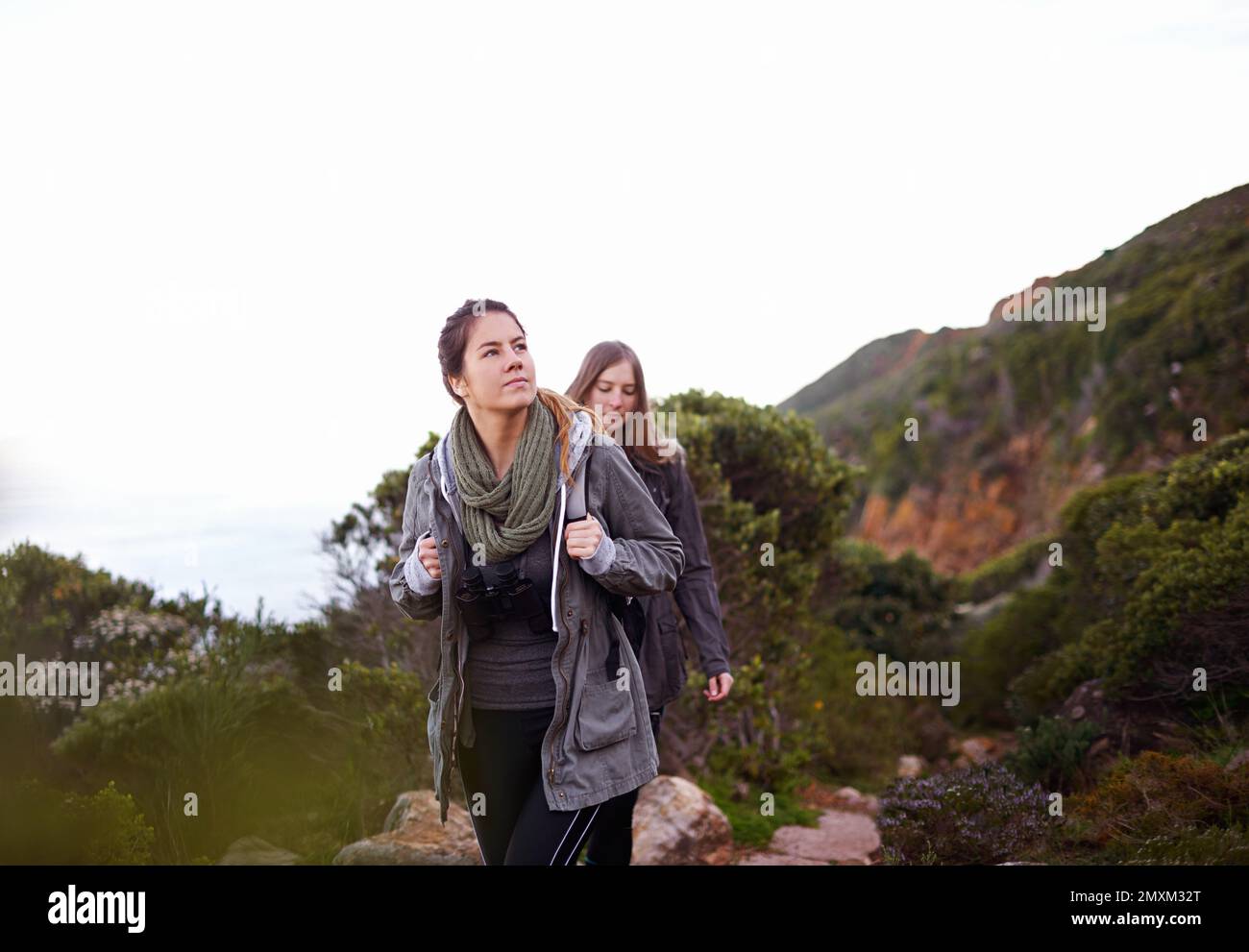 Taking a girls only hike. two attractive young female hikers outdoors ...