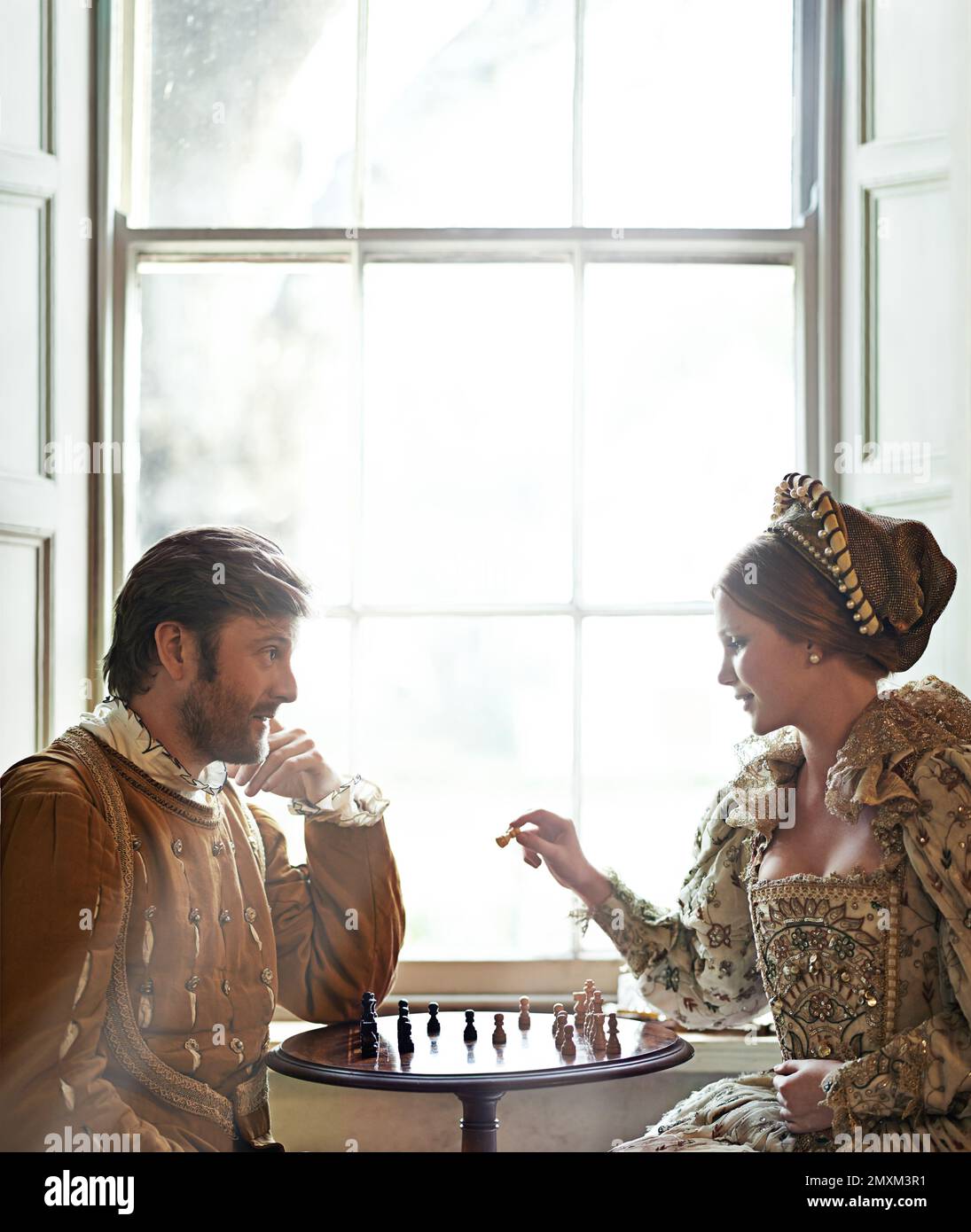 Your move mlove. a an aristocratic couple playing chess Stock Photo - Alamy