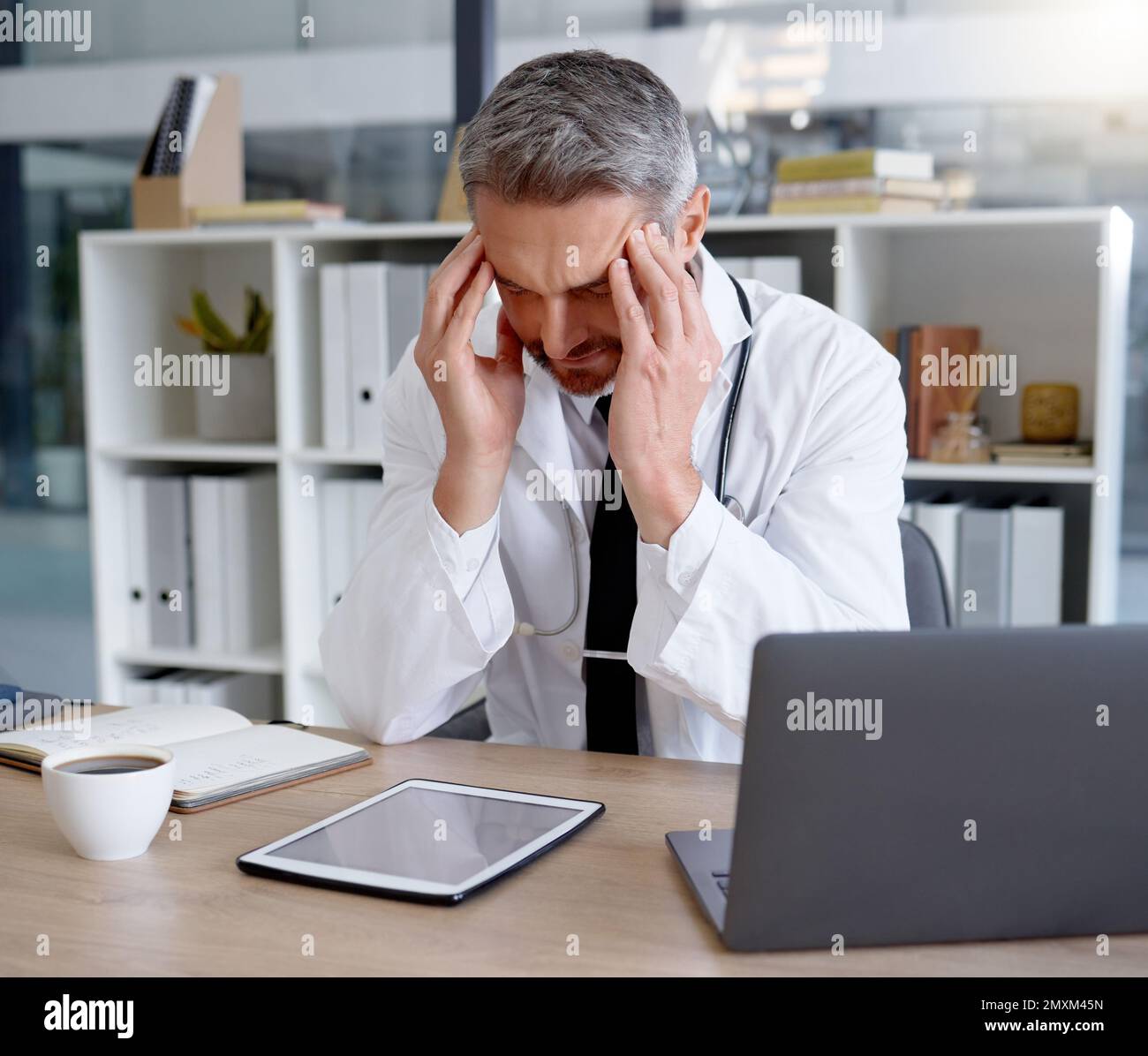 Doctor, burnout and man with headache in hospital feeling depressed ...