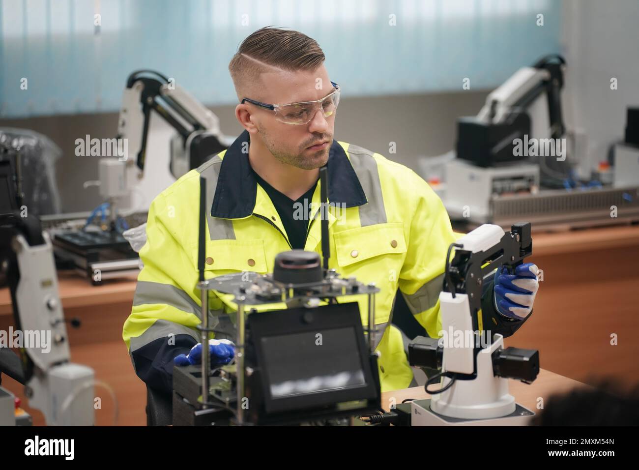 Engineers Maintenance Robot Arm at Lab in a High Tech Research ...