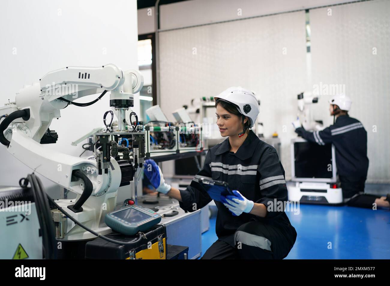Engineers Maintenance Robot Arm at Lab in a High Tech Research ...