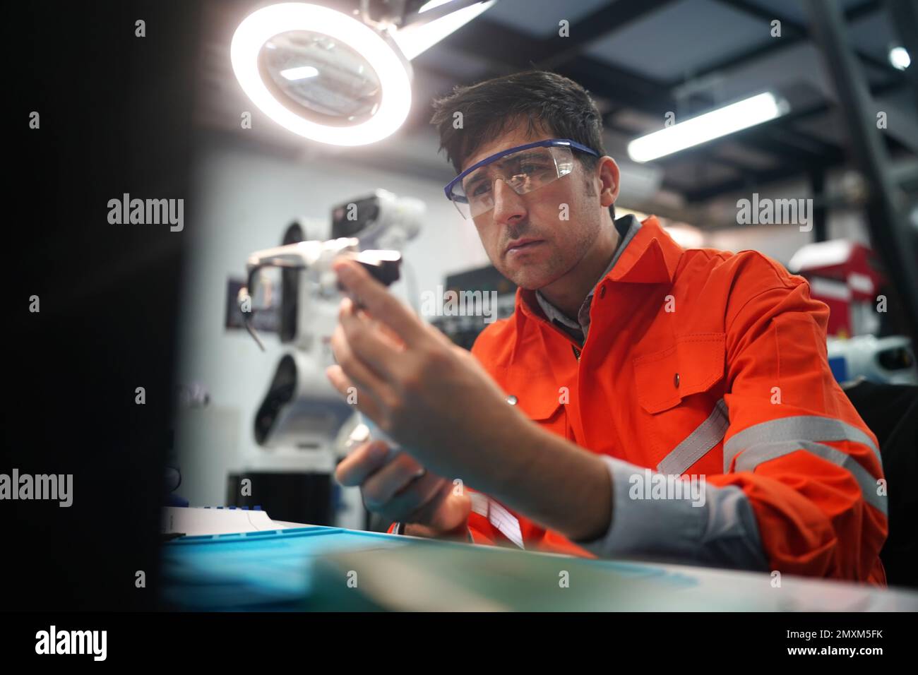 Engineers Maintenance Robot Arm at Lab in a High Tech Research ...