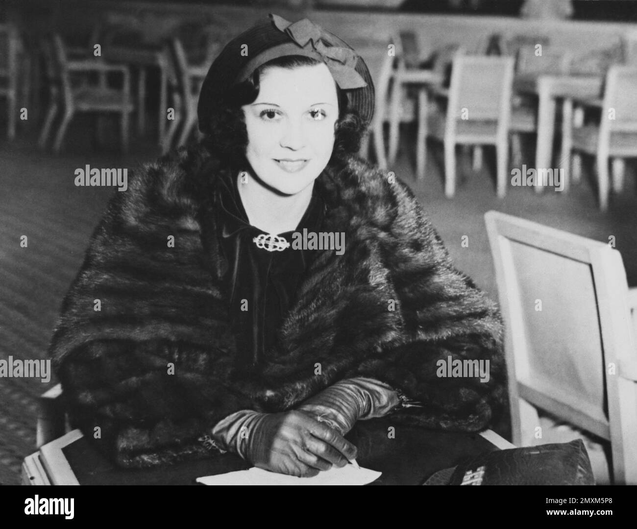 Lita Grey Chaplin, former wife of Charles Chaplin, writing a cable on ...