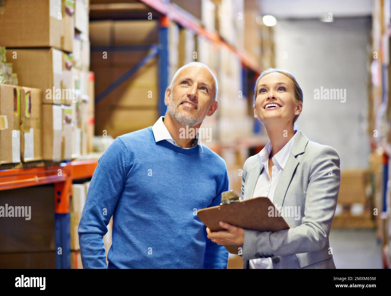 Logistic pros. two people doing an inventory check in a warehouse Stock ...