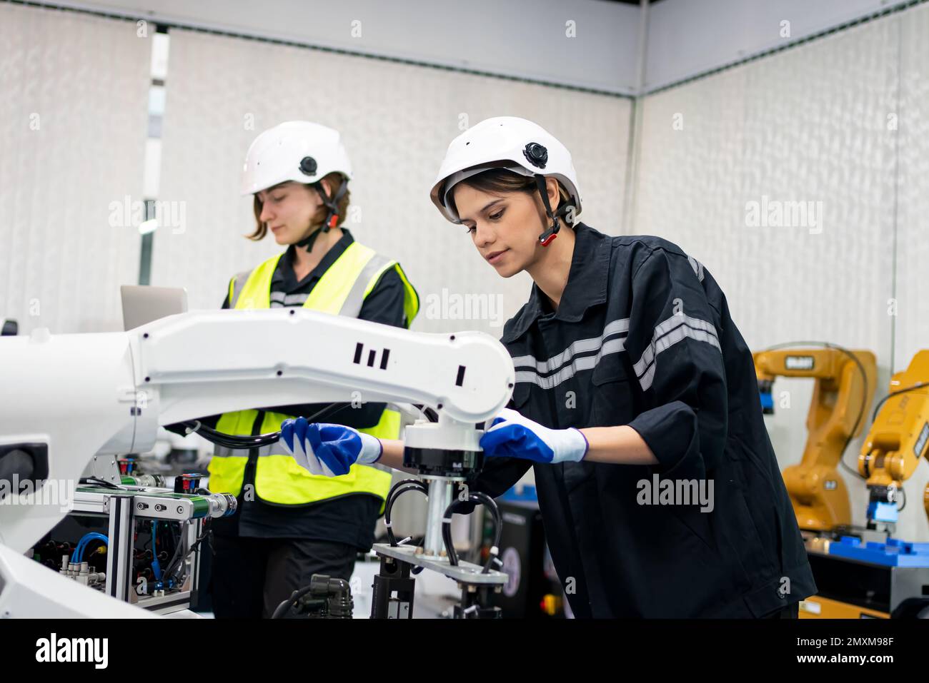 Engineer check and control welding robotics automatic arms machine in ...