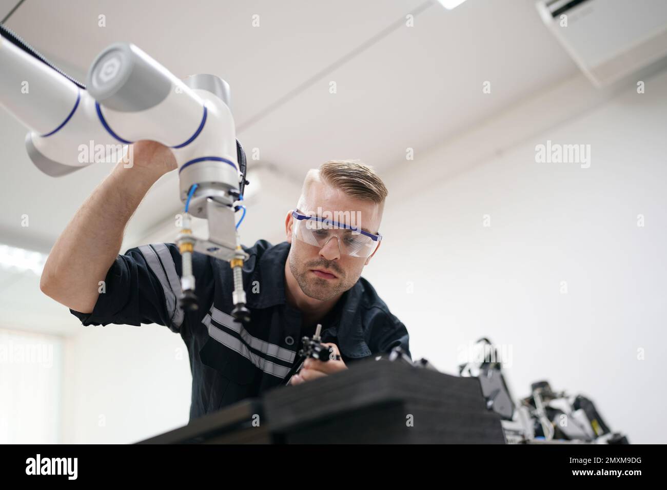 Engineers Maintenance Robot Arm at Lab in a High Tech Research ...