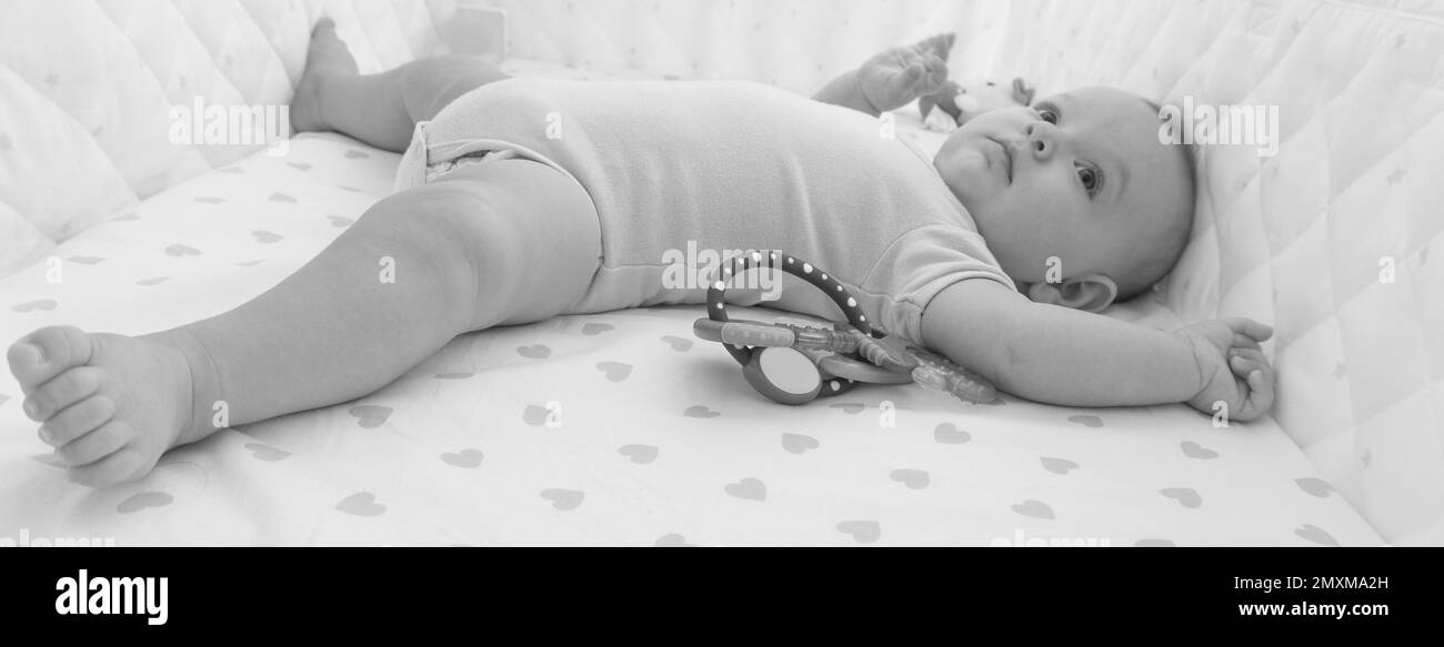 A peaceful baby stay in bed Stock Photo - Alamy