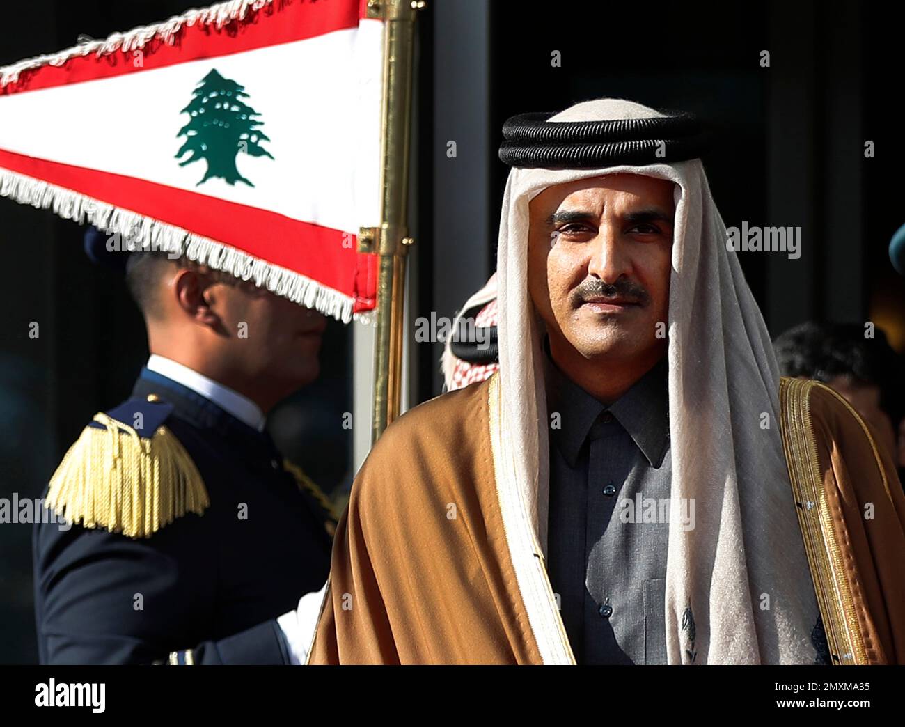 FILE - Qatar's Emir Sheikh Tamim bin Hamad Al Thani reviews the honor ...
