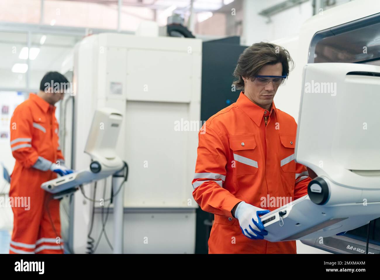 Engineer check and control welding robotics automatic arms machine in ...