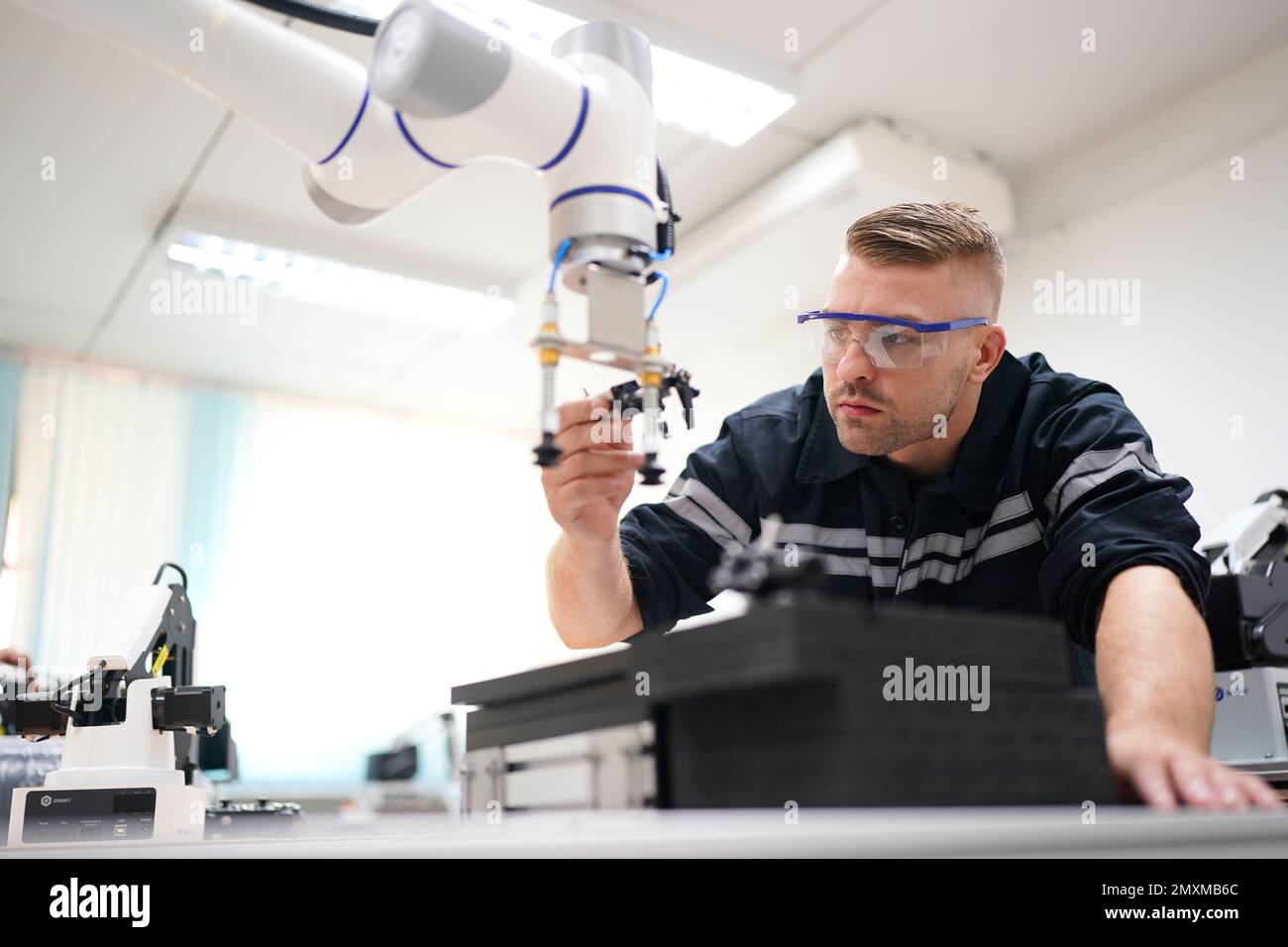 Engineers Maintenance Robot Arm at Lab in a High Tech Research ...