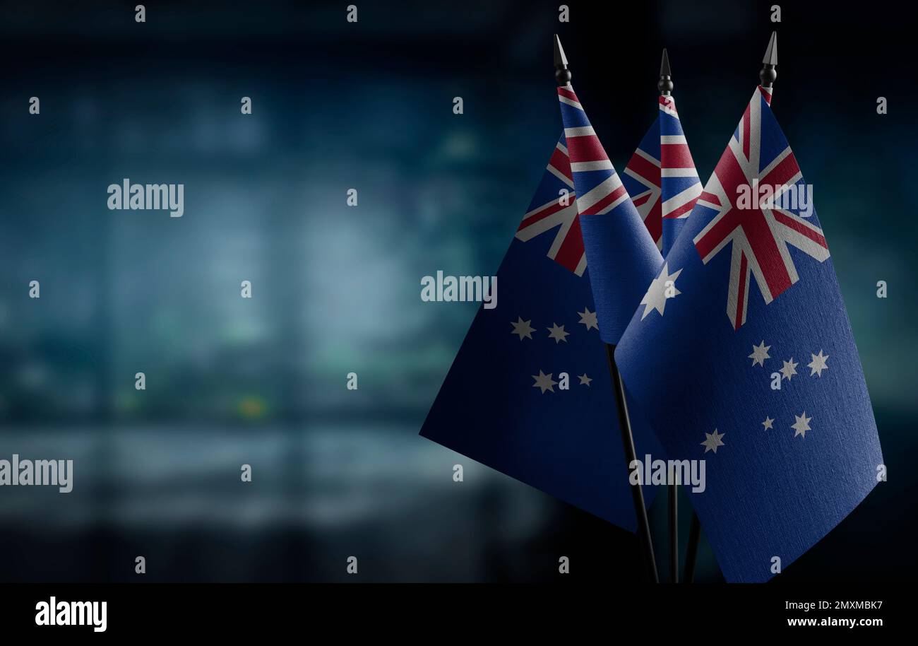 Small flags of the Australia on an abstract blurry background Stock ...