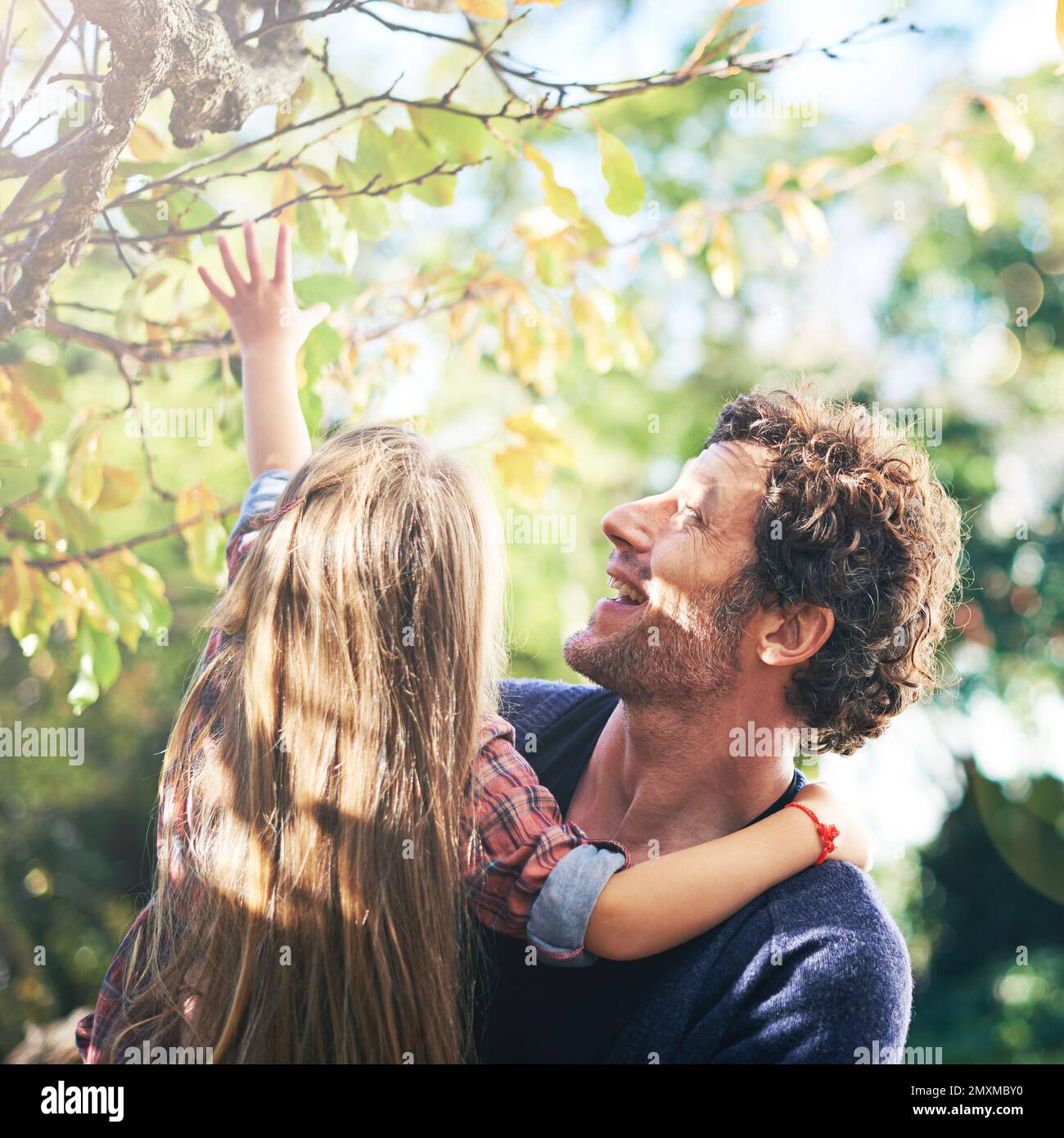 Childhood is filled with natural wonder and curiosity. a little girl ...