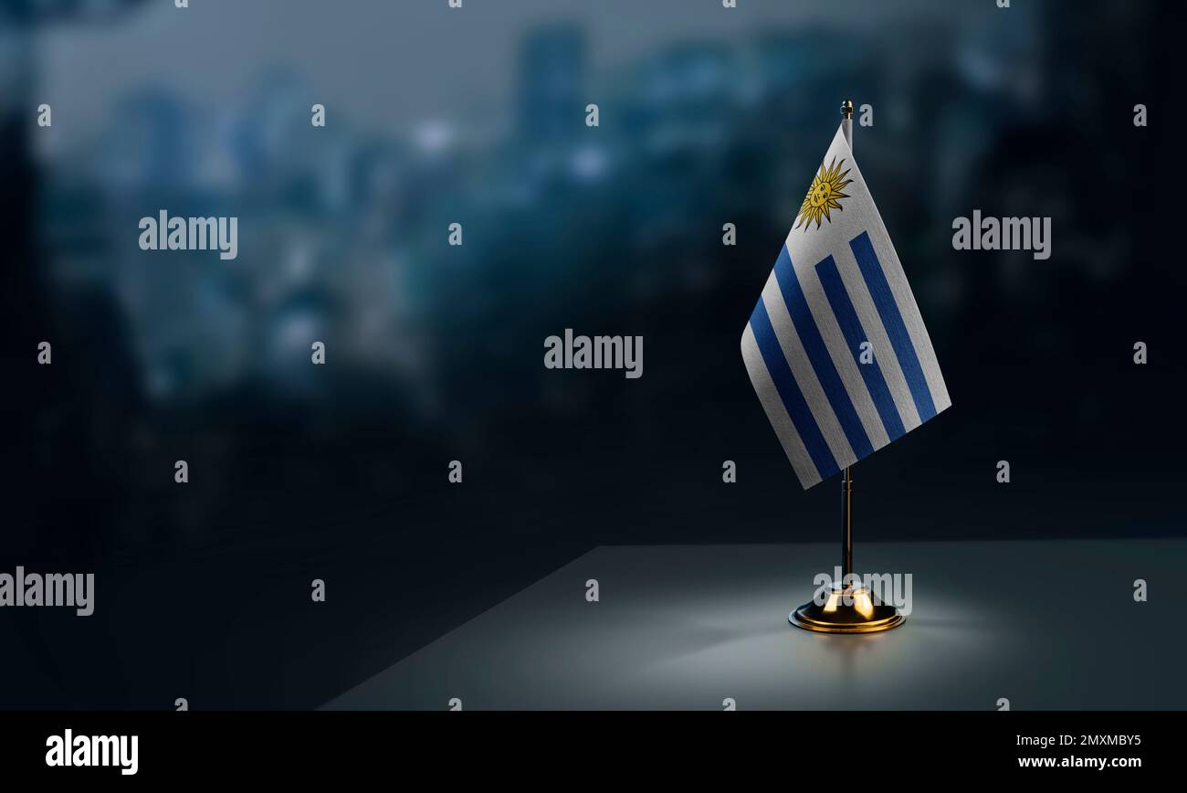 Small flags of the Uruguay on an abstract blurry background Stock Photo ...