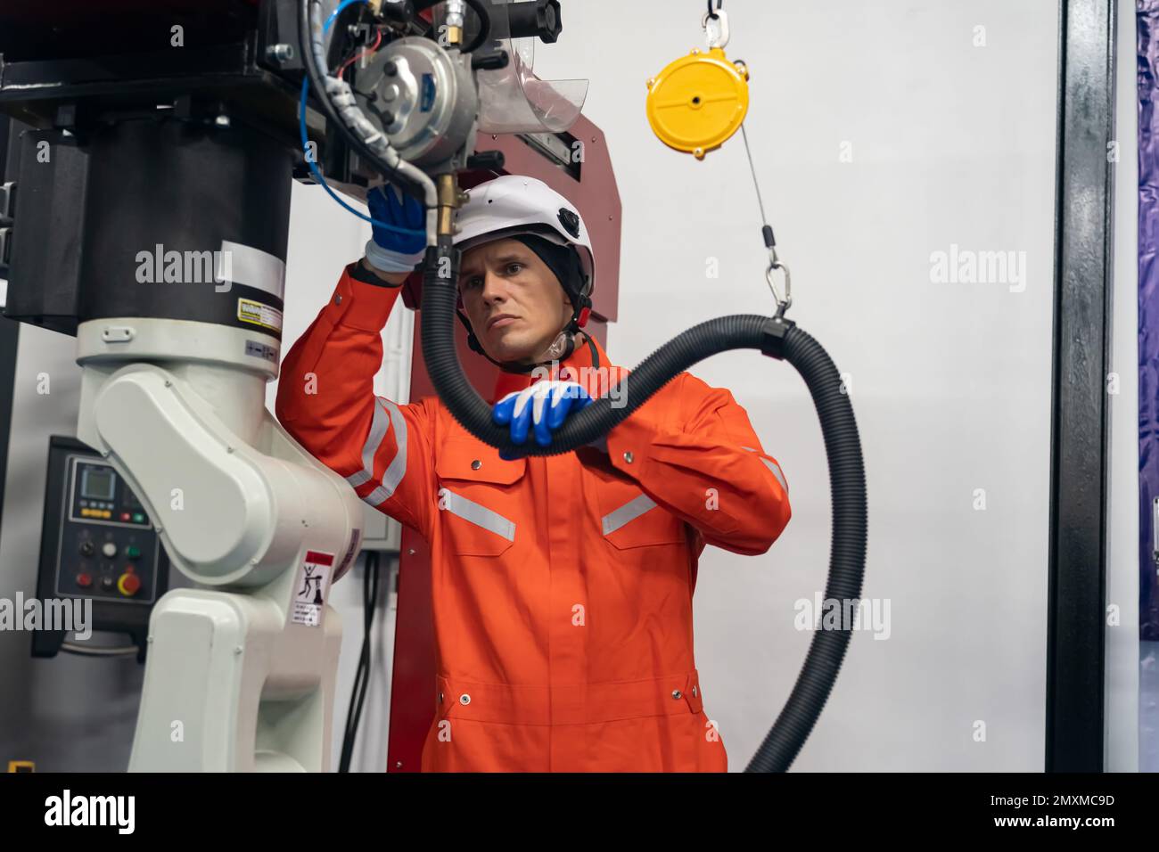 Engineer check and control welding robotics automatic arms machine in ...