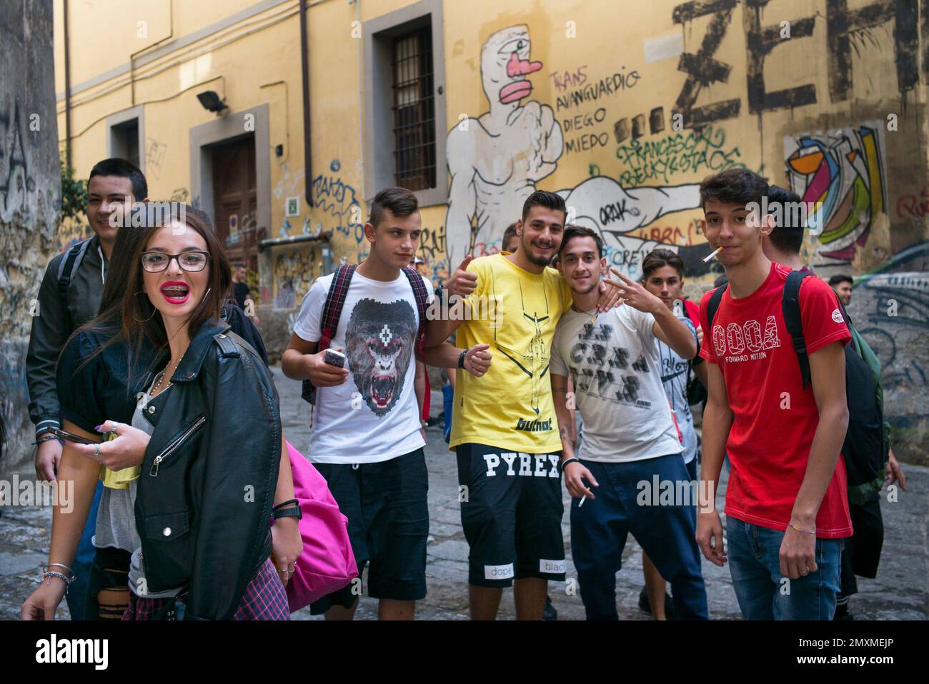 Italian students smile posing for a photo after classes in Naples ...